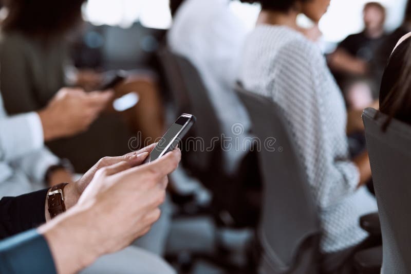 Note Taking in the Smart Age. a Group of Businesspeople Using Their ...