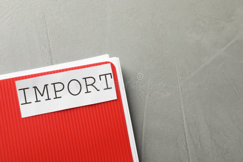 Note with Word Import Attached To Folder of Documents on Grey Table ...