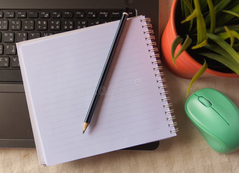 The Notebook that Align Over the Laptop with the Pencil, Little Stock ...