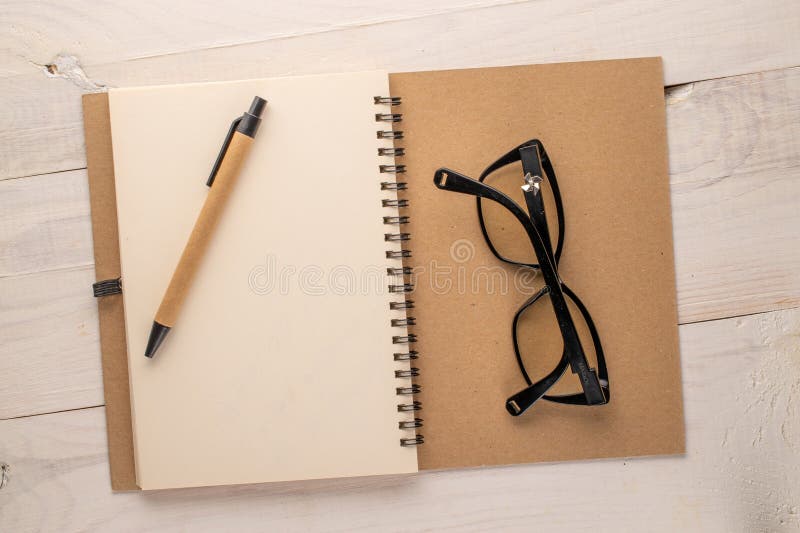 One Notebook, Glasses and a Pencil on a Wooden Table, Macro, Top View ...