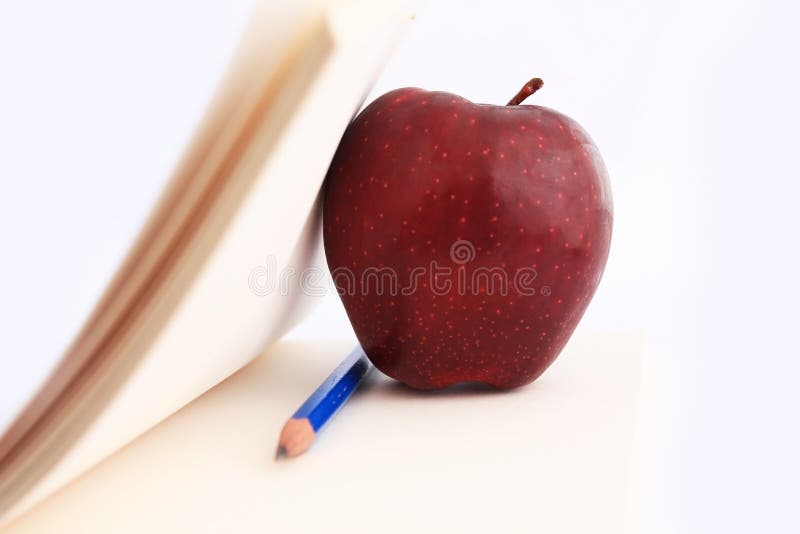Red Apple on Notebook with Pencil on White Background. Stock Photo ...