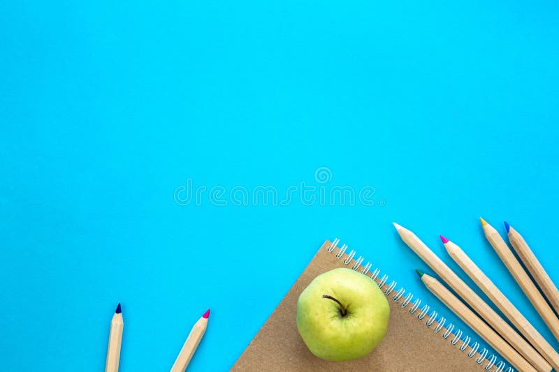 Notebook, Apple and Pencils on a Blue Background, Top View. Stock Image ...