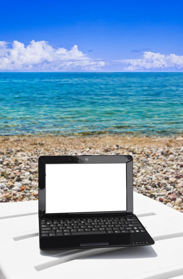 Laptop Computer with Sunny Beach Image on Wooden Table. Summer Vacation ...