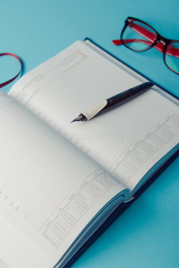 Notebook on Blue Paper. Open Diary and Pen To Record Stock Image ...