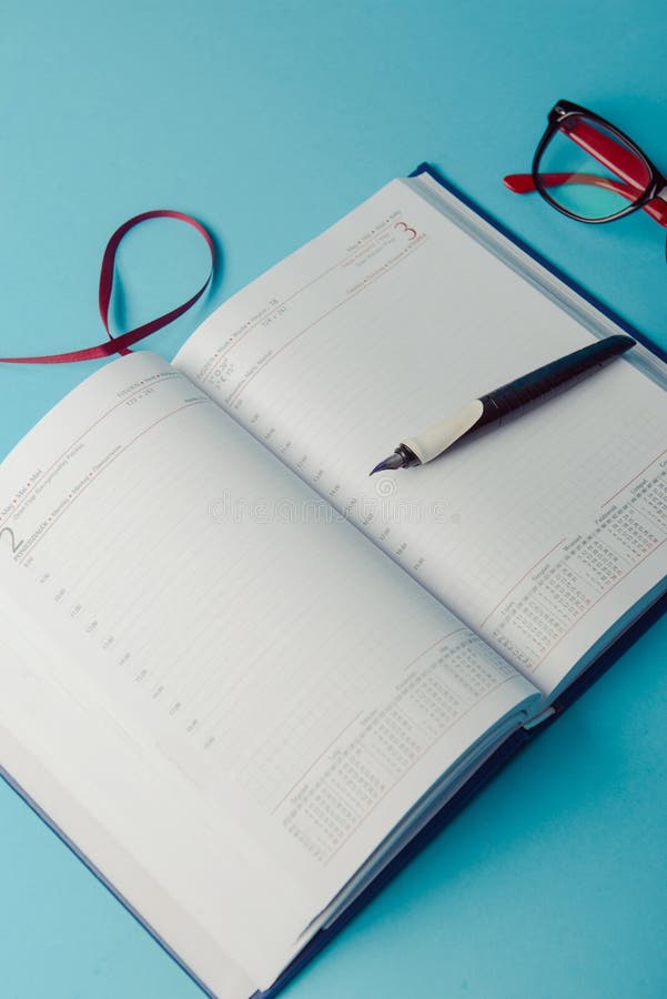 Notebook on Blue Paper. Open Diary and Pen To Record Stock Photo ...