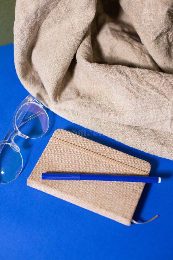 Notebook in a Burlap Cover with a Blue Felt-tip Pen and Glasses Near ...
