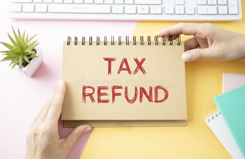 Notebook with a Business Notes TAX REFUND on the Office Table with ...