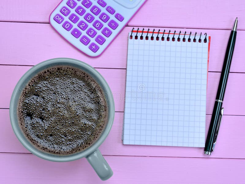 Notebook with Calculator and Coffee Cup on Purple Table Stock Image ...