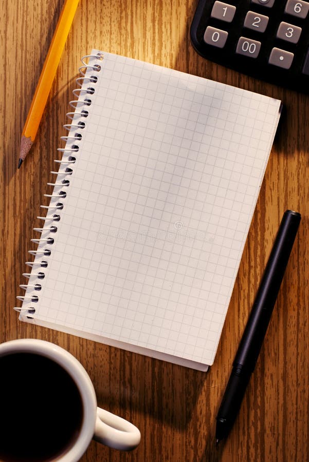 Notebook and Calculator on Desk with Cup of Coffee Stock Photo - Image ...