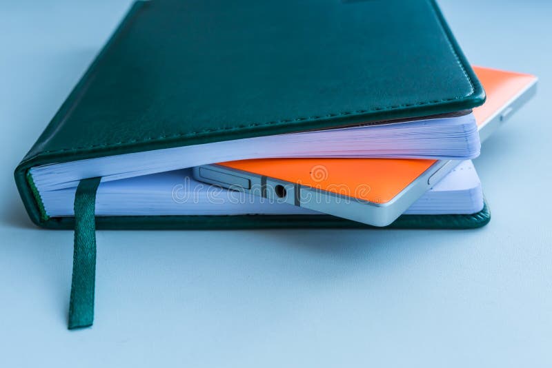 Notebook and cell phone stock photo. Image of business - 84807562