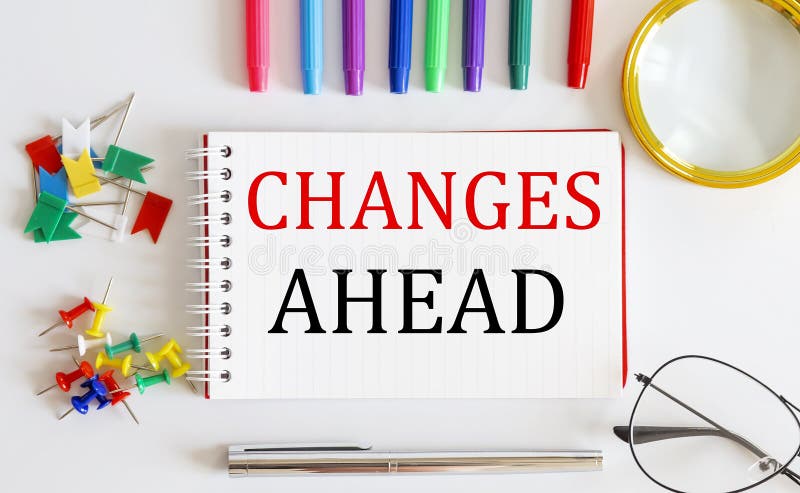 Notebook with Changes Ahead Word with Office Tools on the White Table ...