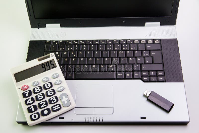 Notebook Computer on the Desk.Calculators,USB Flash Drive Stick Stock ...