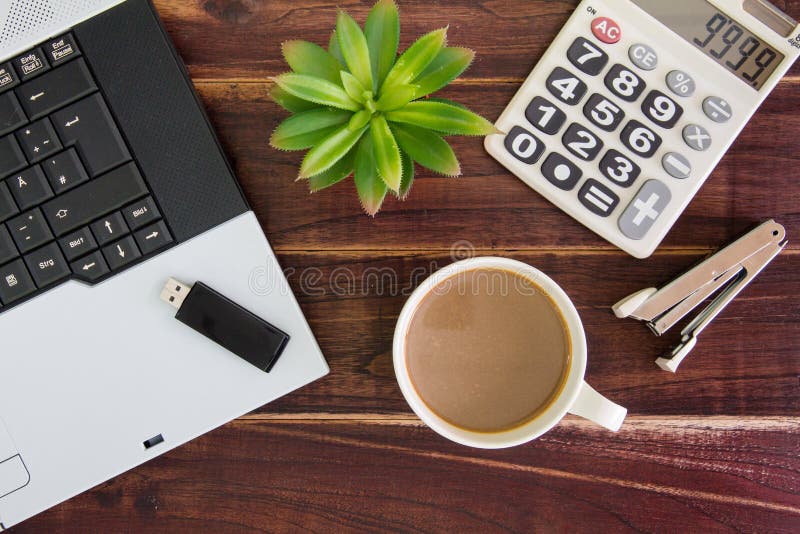 Notebook Computer on the Desk.Calculators,USB Flash Drive Stick,coffee ...