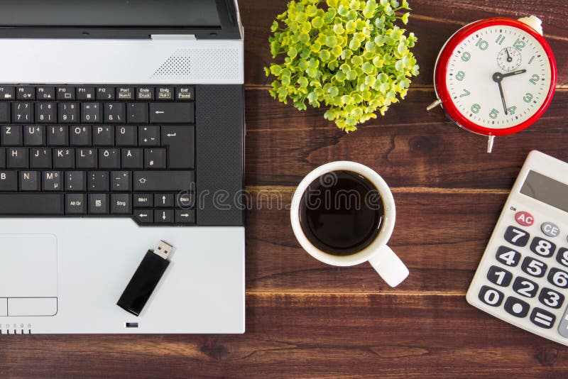 Notebook Computer on the Desk.Calculators,USB Flash Drive Stick,coffee ...