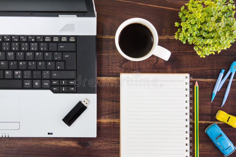 Notebook Computer on the Desk.USB Flash Drive Stick,paper,coffee Cup ...