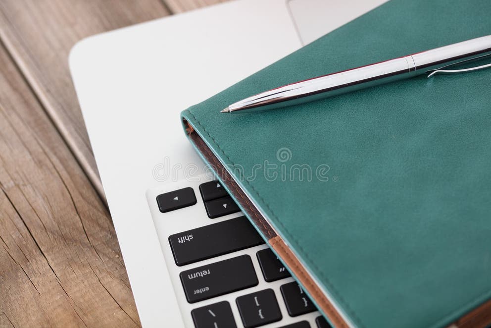Notebook on a Computer Keyboard Stock Photo - Image of computer, items ...