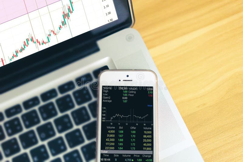 Notebook Computers Open the Screen To View Investments in Stocks. and ...