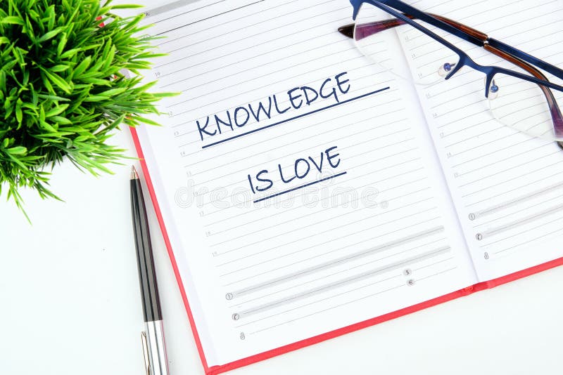 A Notebook Displays the Phrase Knowledge is Love Along with Reading ...