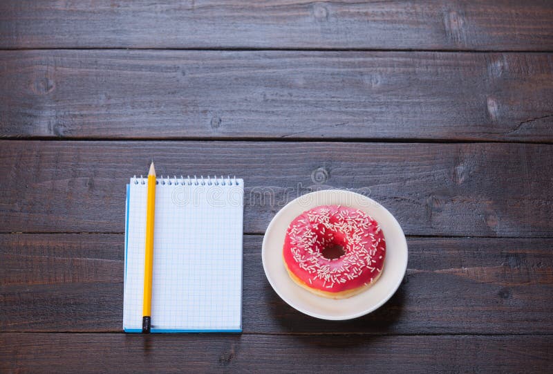 Notebook and donut stock image. Image of sharp, pattern - 40825143