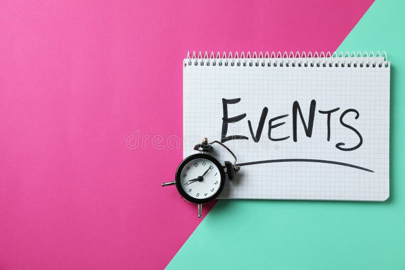 Notebook with Events and Alarm Clock on Two Tone Background Stock Image ...