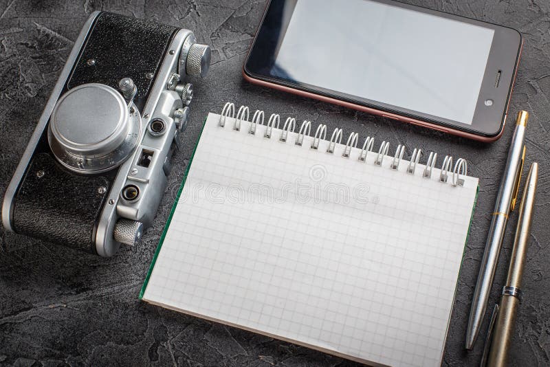 Notebook with film camera. stock photo. Image of film - 83865070