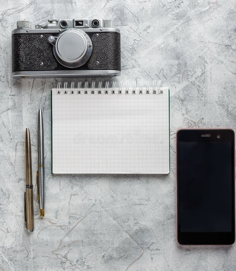 Notebook with film camera. stock photo. Image of empty - 83866744