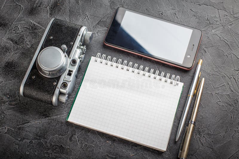 Notebook with film camera. stock photo. Image of design - 83870068