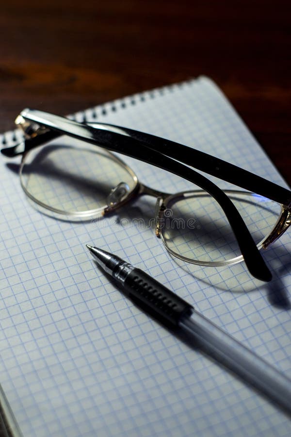 Notebook glasses and pen stock photo. Image of book - 176055084