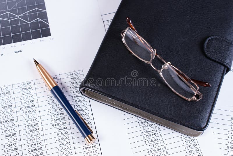Notebook, Glasses and Pen on the Table with Documents Stock Image ...