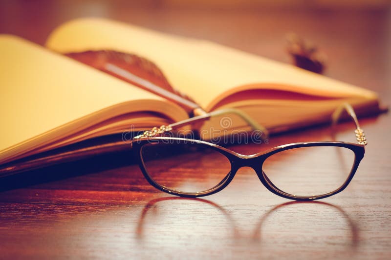 Notebook and Glasses on a Wooden Table Stock Photo - Image of desk ...