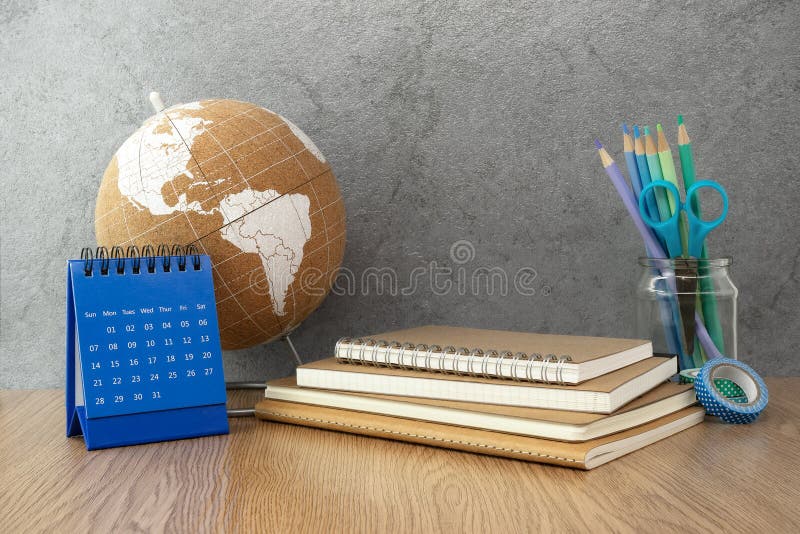 Notebook and Globe and Calendar on Table. Work Desk Space Stock Photo ...