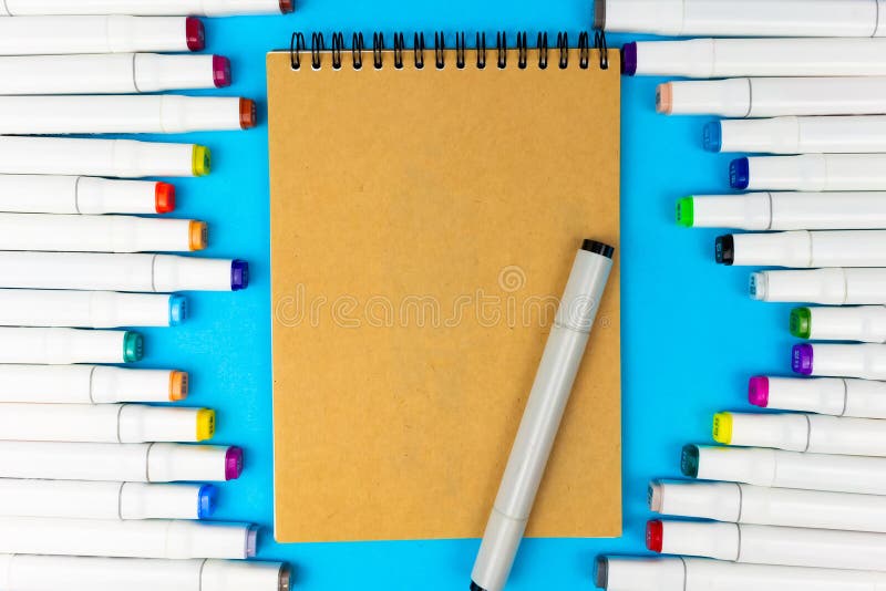 A Notebook with a Gray Felt-tip Pen on a Blue Background Stock Photo ...