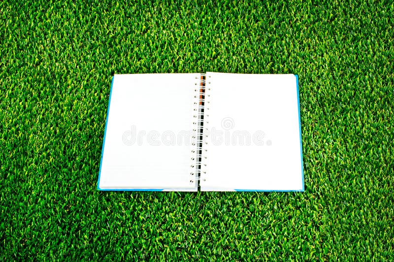Notebook on Green Grass Background Stock Photo - Image of object, white ...