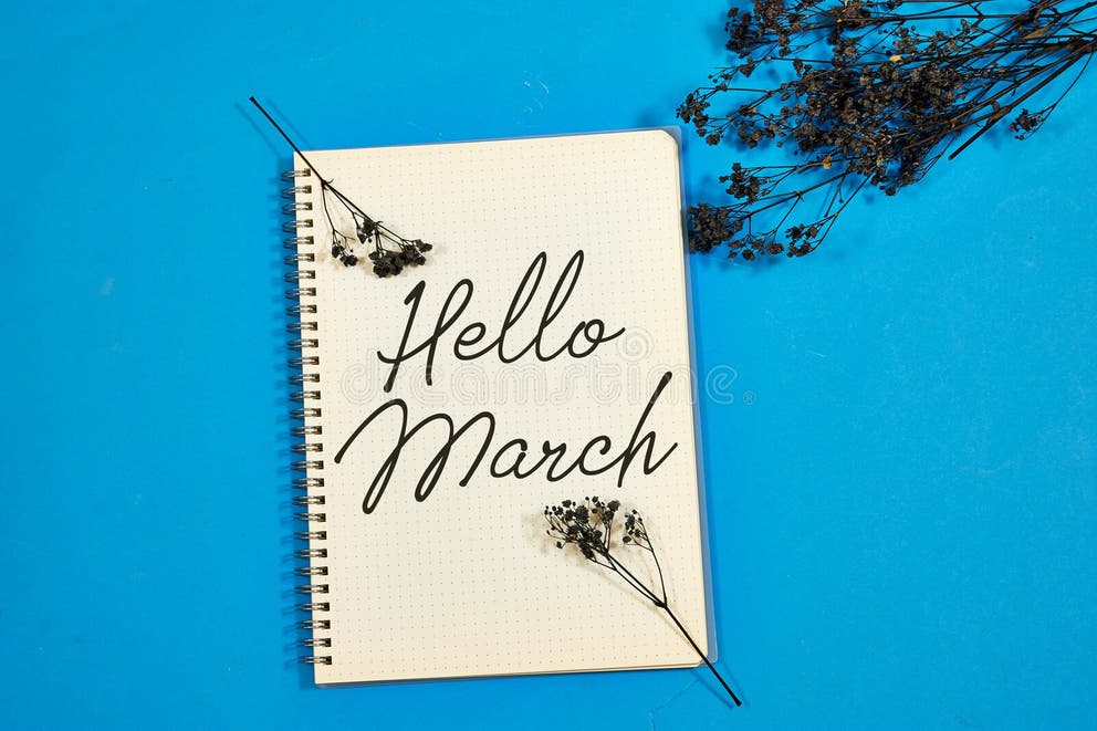 Notebook with Hello March Text on Blue Background with Organic ...