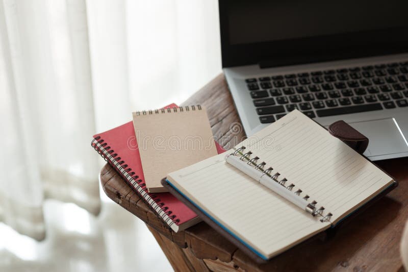 Notebook and Laptop Computer on Wood Table Stock Photo - Image of ...