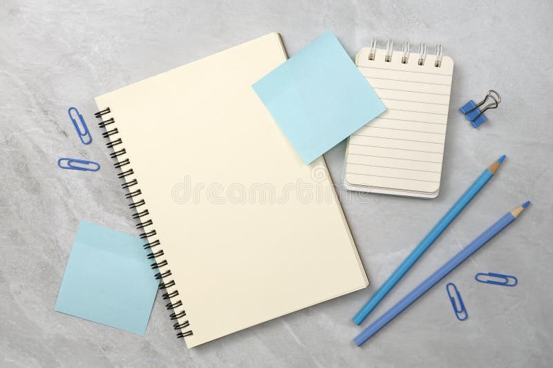 Notebook and Light Blue Stationery on Stone Texture Background. Work ...
