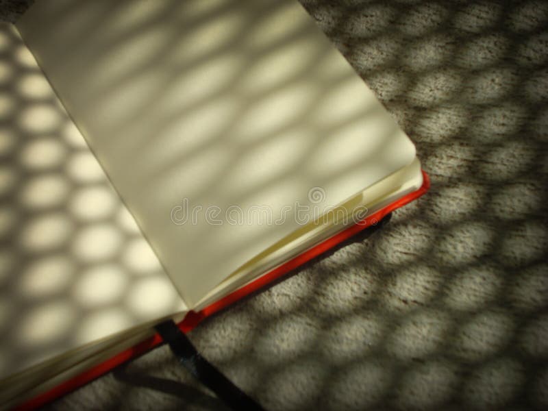 Notebook with Light Shapes Coming through the Window Stock Photo ...