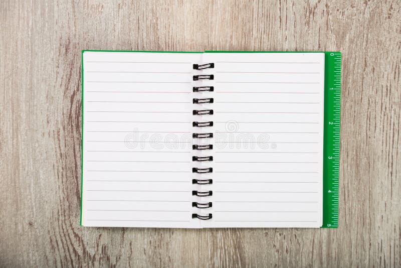 Notebook in line on table stock image. Image of clean - 205649727