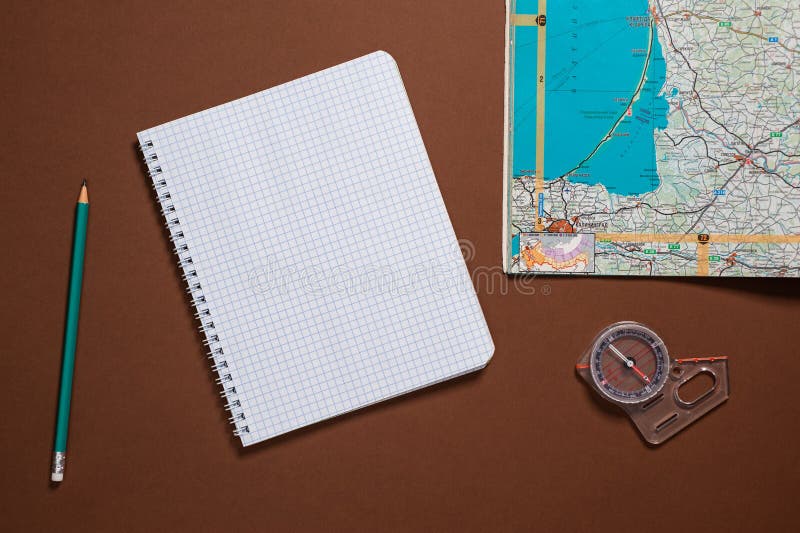 Notebook, Map and Compass are on the Table Stock Photo - Image of ...