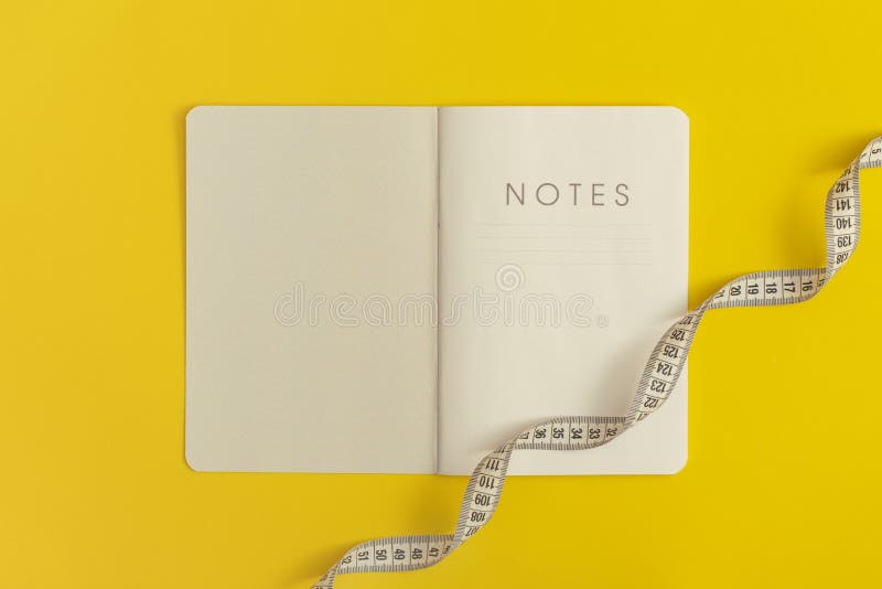 Notebook and Measuring Tape on Yellow Background. Top View Stock Photo ...