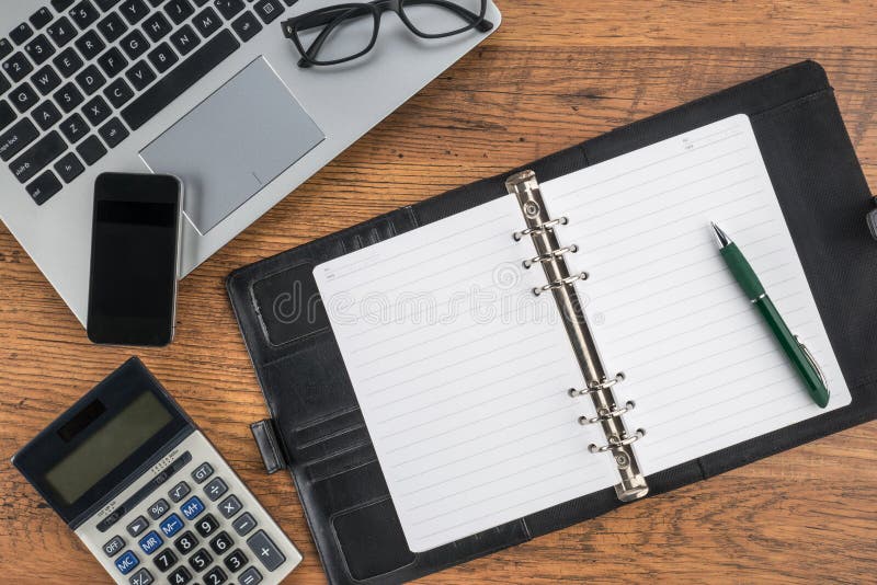 Notebook Mobile Phone and Pen with Calculator on the Desk Stock Image ...