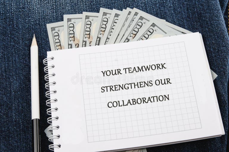 A Notebook with a Motivational Message about Teamwork Sits Atop a Stack ...