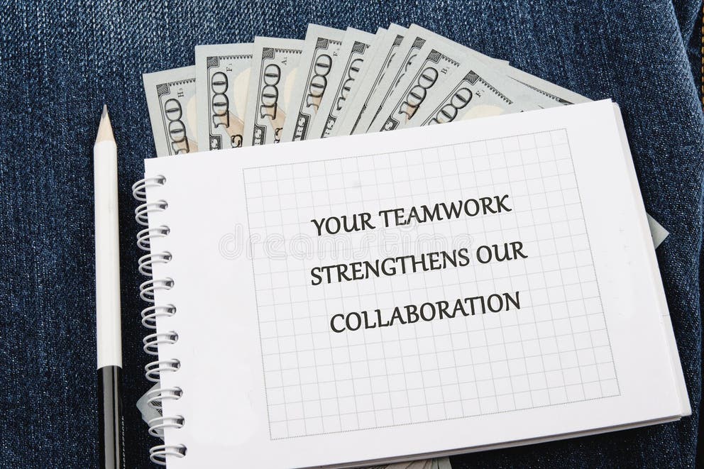 A Notebook with a Motivational Message about Teamwork Sits Atop a Stack ...