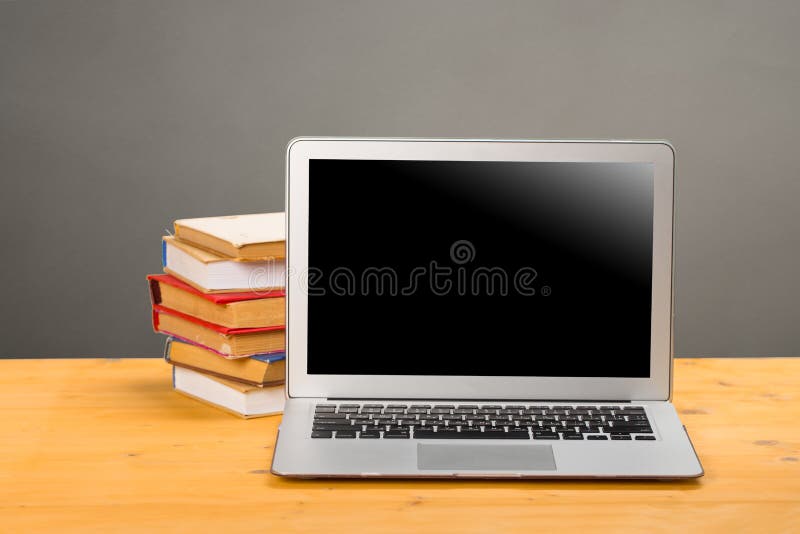 Notebook with Multi-colored Books on a Wooden Table. Mocap. Work from ...