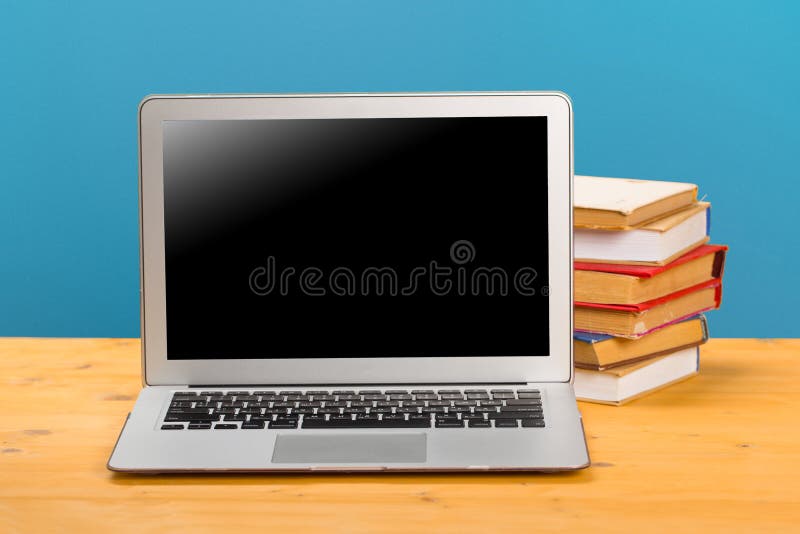 Notebook with Multi-colored Books on a Wooden Table. Mocap. Work from ...