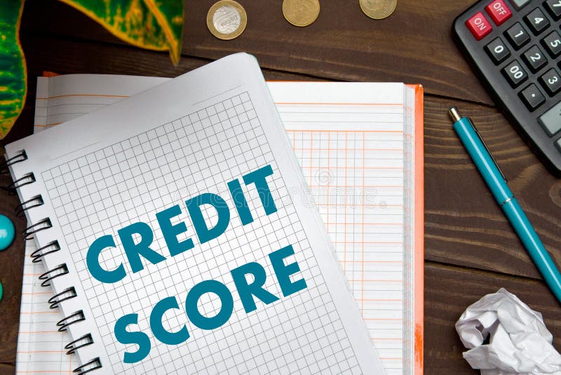 Notebook with a Notes CREDIT SCORE on the Office Table with Tools ...