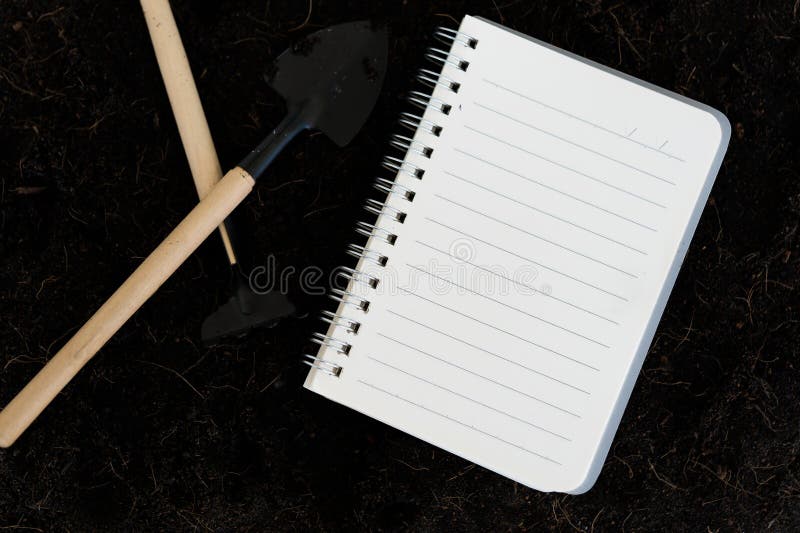 A Notebook for Notes with Mini Garden Tools on Soil. the Concept of ...