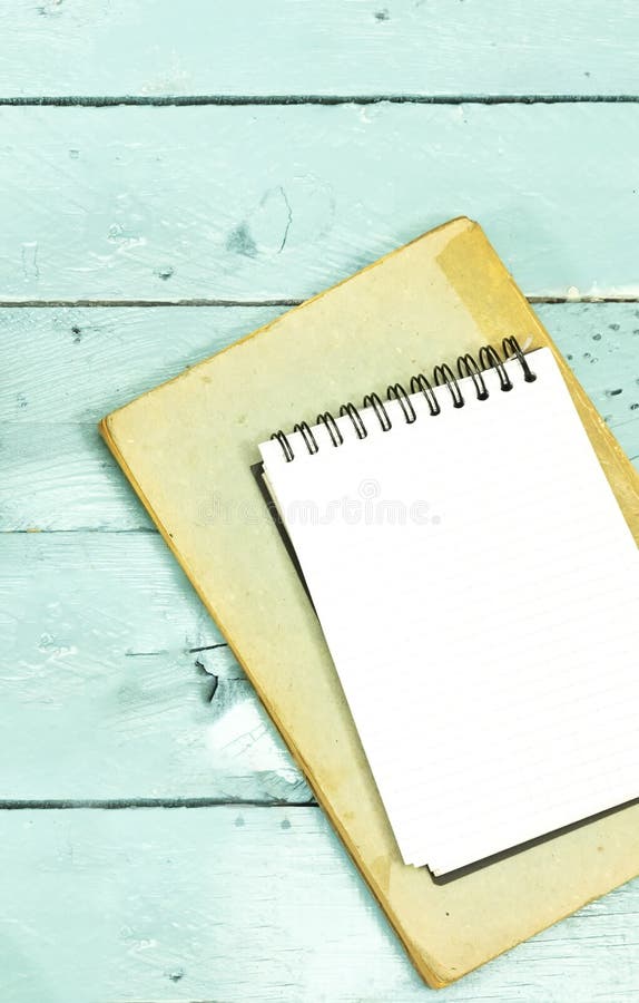 Notebook and Old Book Isolated on Wood Table Stock Image - Image of ...