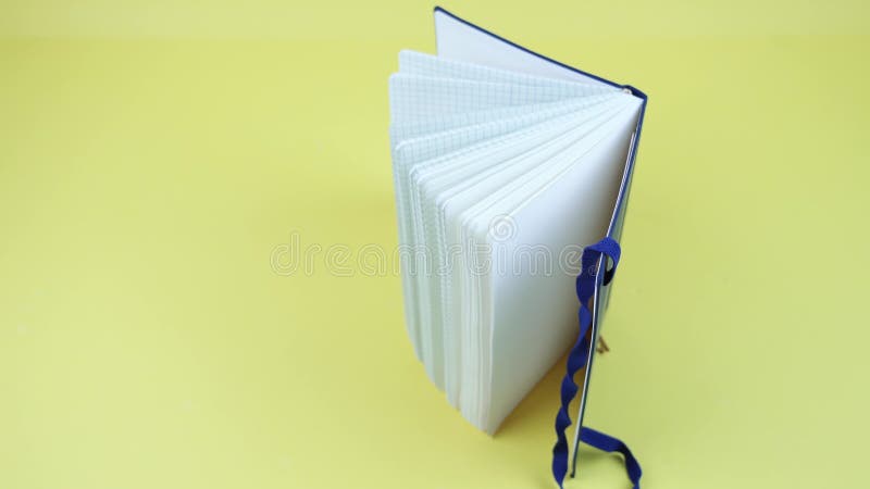 An Open Notebook with Top View on a Yellow Background Stock Footage ...