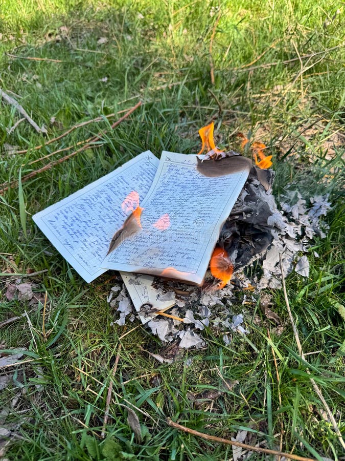 Notebook Pages with Handwritten Text Burn on Grass As Flames Consume ...